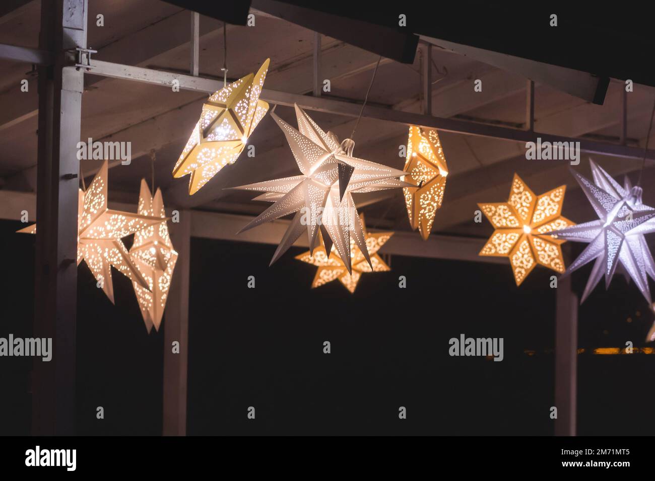 Glowing electric decorations in a winter snowy street, night decor ...