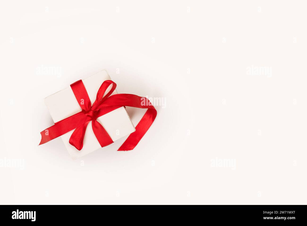 White box with red bow on a white background with copy space Stock ...