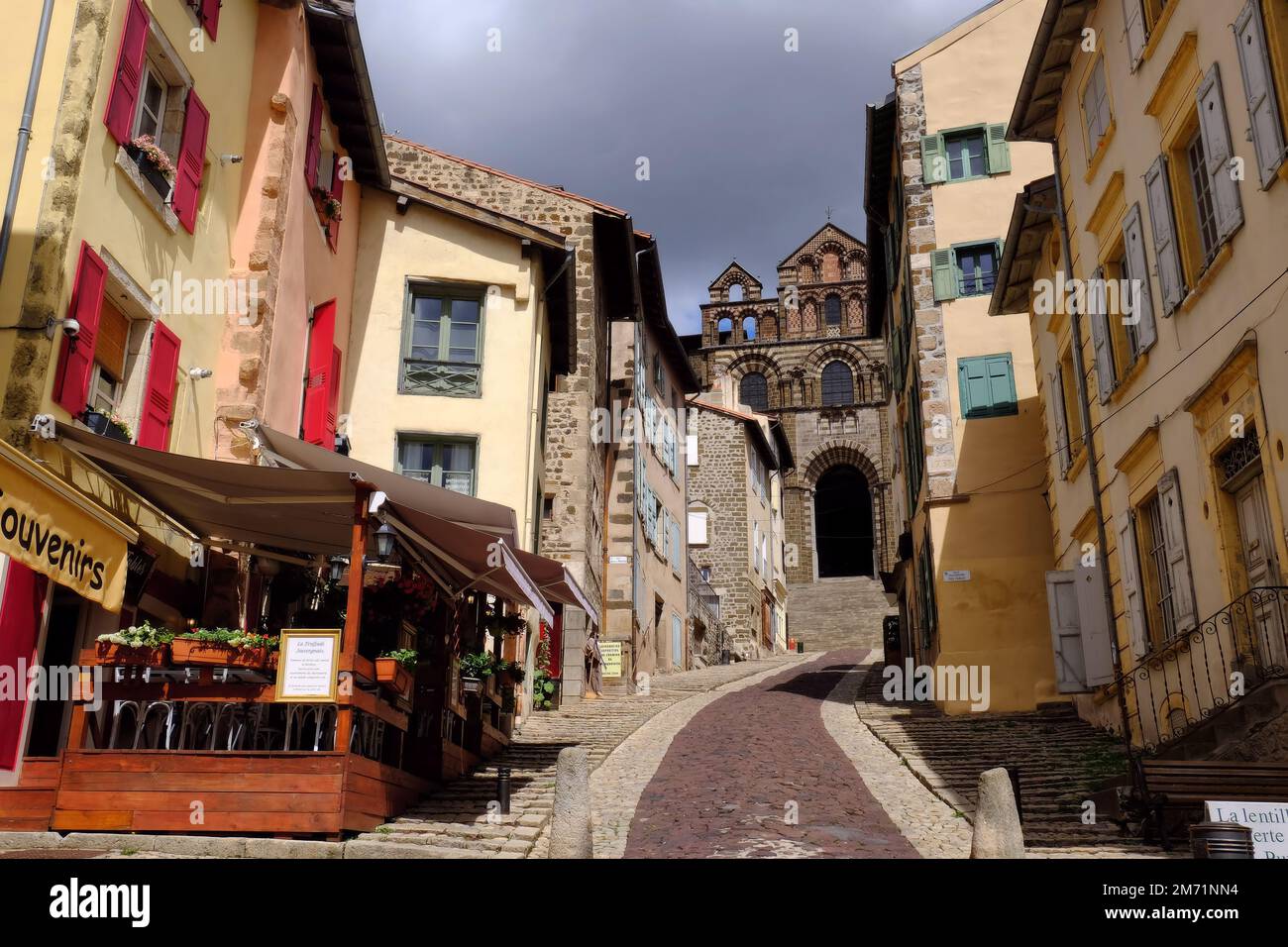 Le Puy en Velay: Path with colourful buildings up to Cathedral Notre ...
