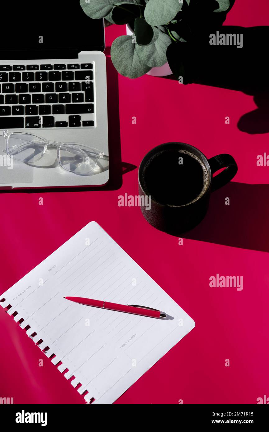 flat lay composition of empty notebook, coffee, computer and glasses on ...