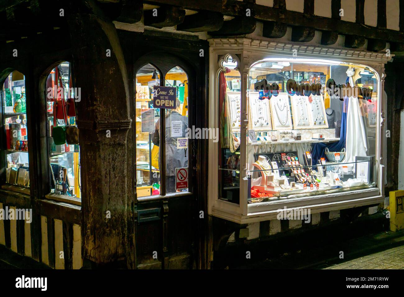 Shop window with very old wooden beams lit up at night in Saffron ...