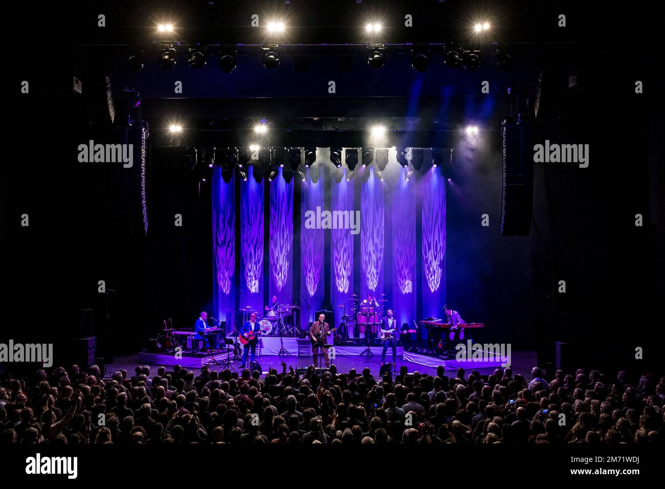 GUILDFORD, ENGLAND: Dr John Cooper Clarke and Squeeze perform on stage ...
