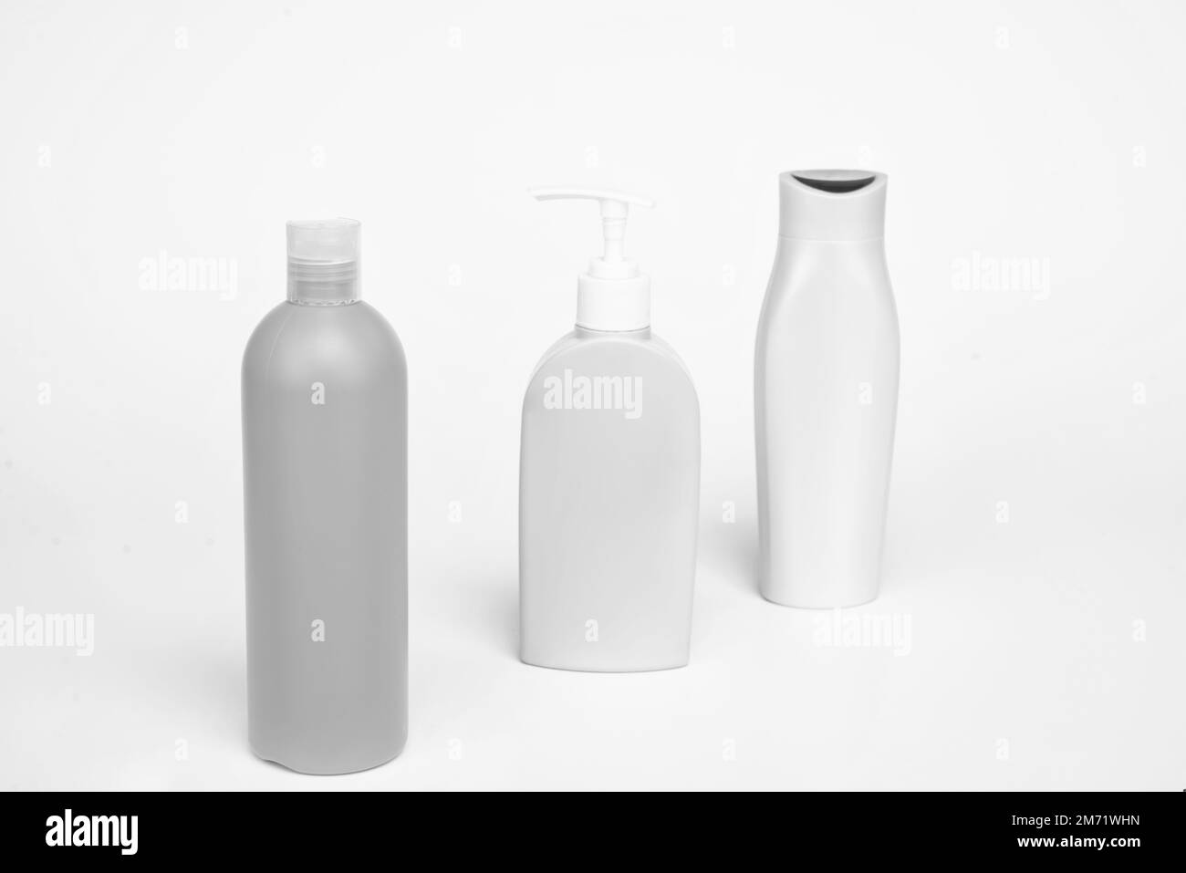 Plastic toiletry containers for liquid cosmetic products in row ...