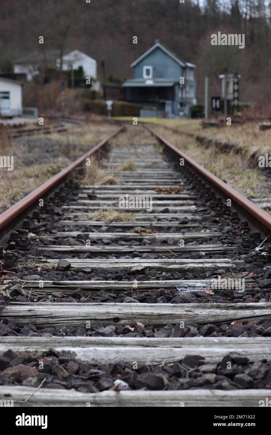 Railway track in a disused railway station Stock Photo - Alamy