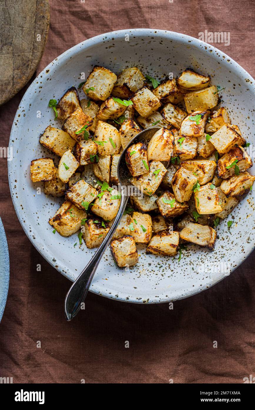 Seasoned and roasted turnips in a bowl Stock Photo - Alamy