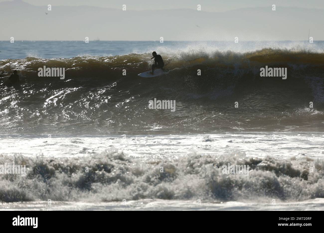 Carpinteria, California, USA. 6th Jan, 2023. A surfer rides a wave at ...