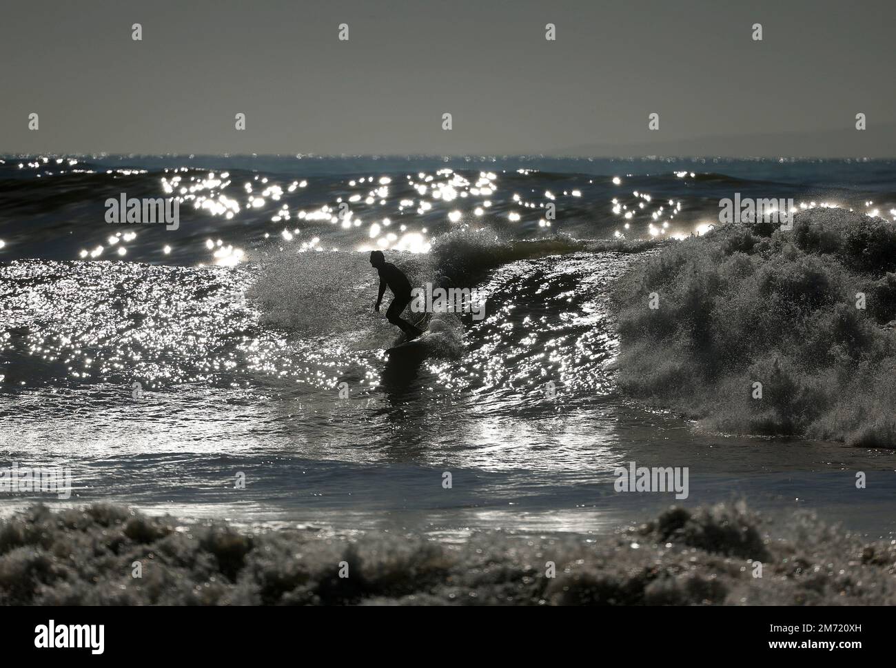 Carpinteria, California, USA. 6th Jan, 2023. A surfer rides a wave at ...