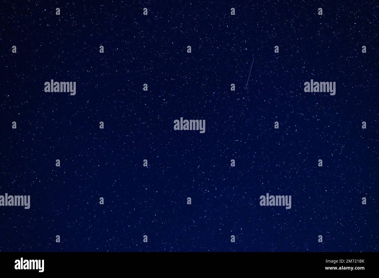 Shooting star meteorite comet on the background of a blue starry sky ...
