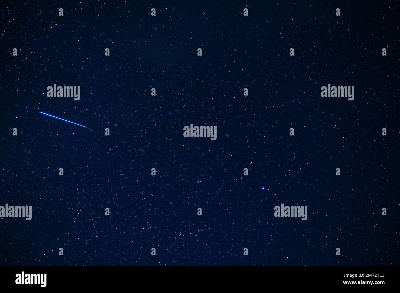 shooting star meteorite comet on the background of a blue dark starry ...