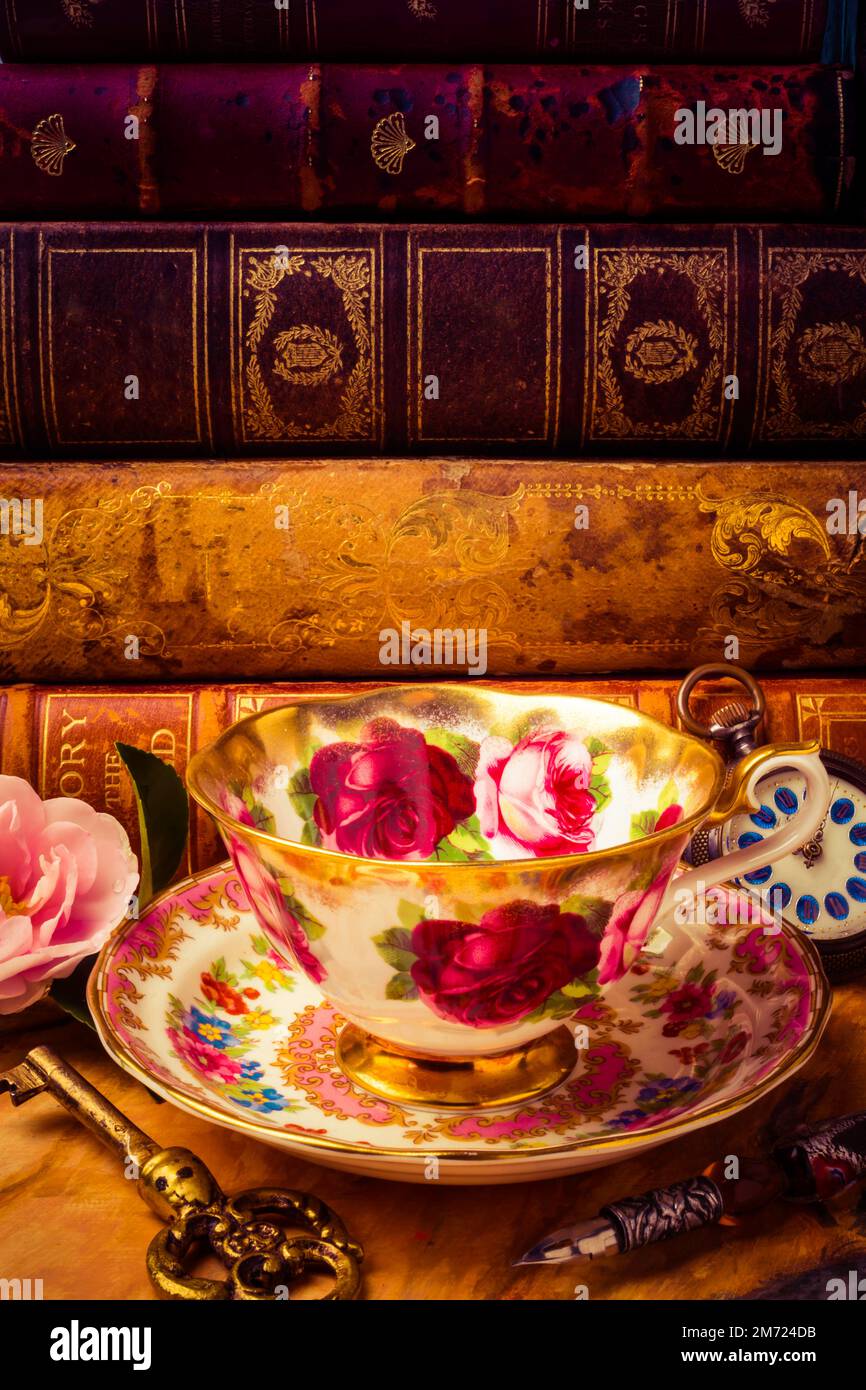 Tea Cup And Old Books Stock Photo - Alamy