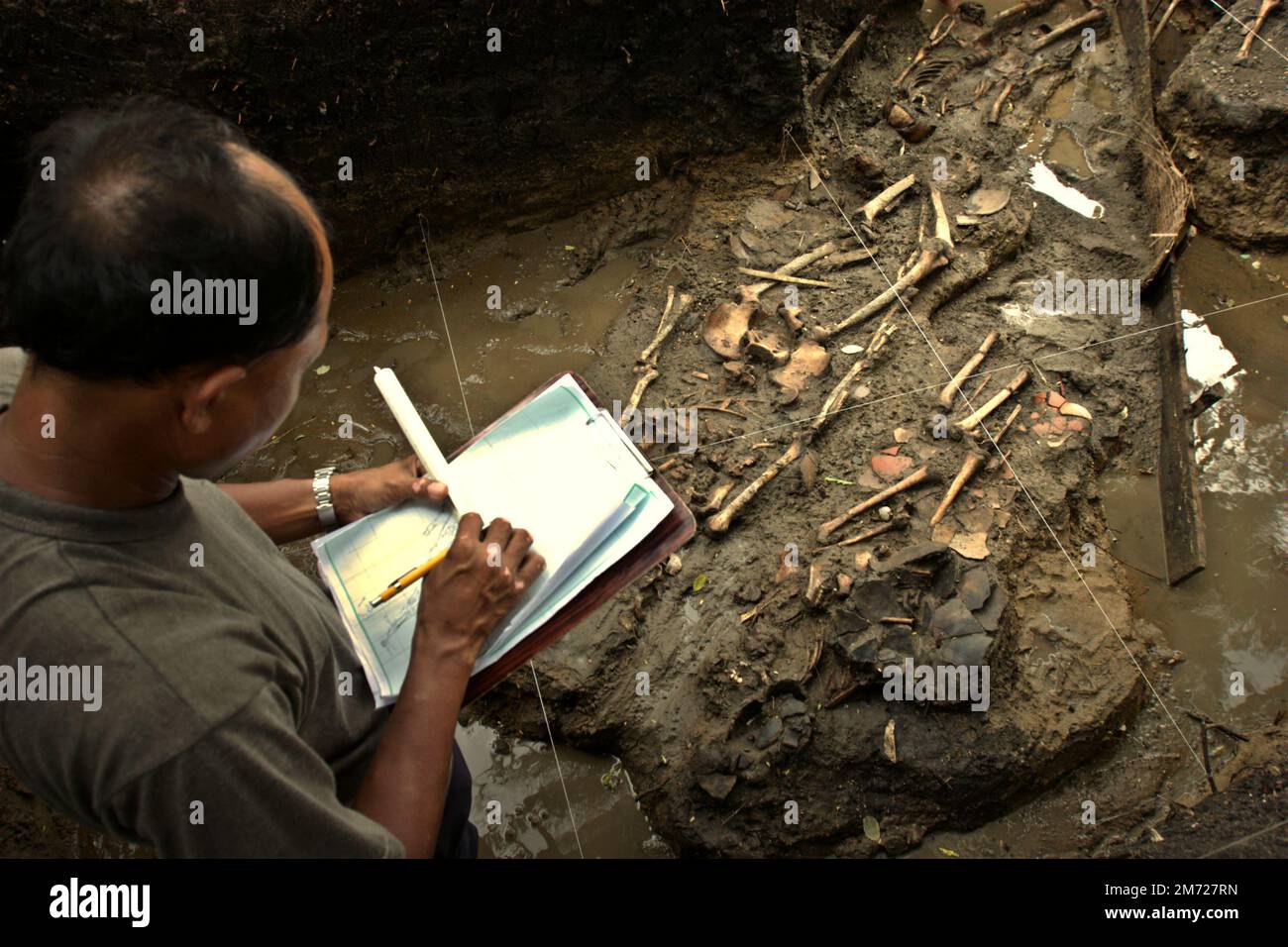 A scientist is making a sketch on paper, showing the locations of the ...