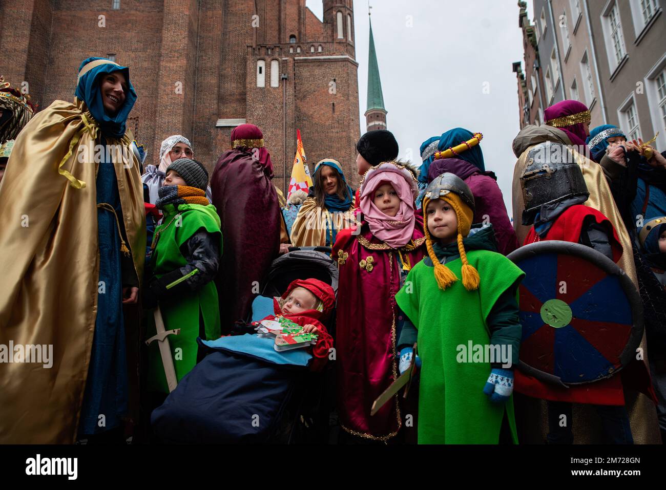 Children dressed as kings and other characters take part in a march. On ...