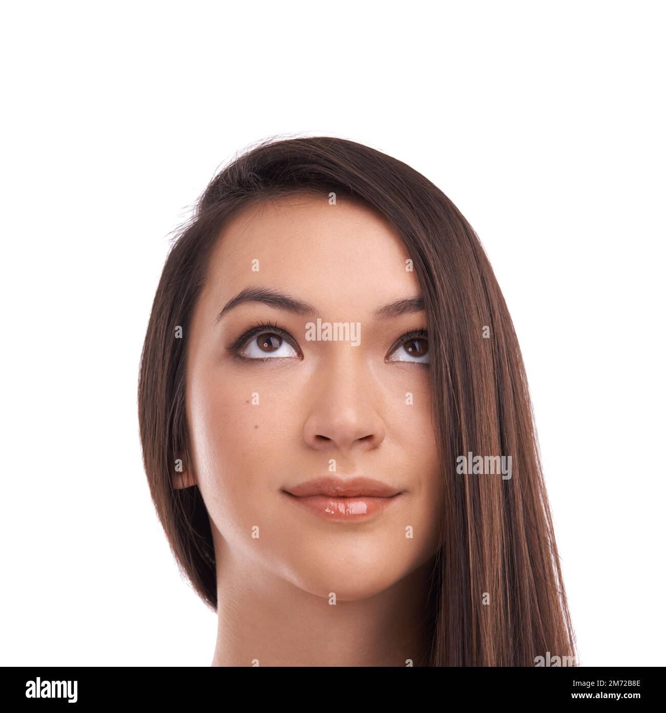 Thinking of what the future holds....Studio headshot of a young woman ...