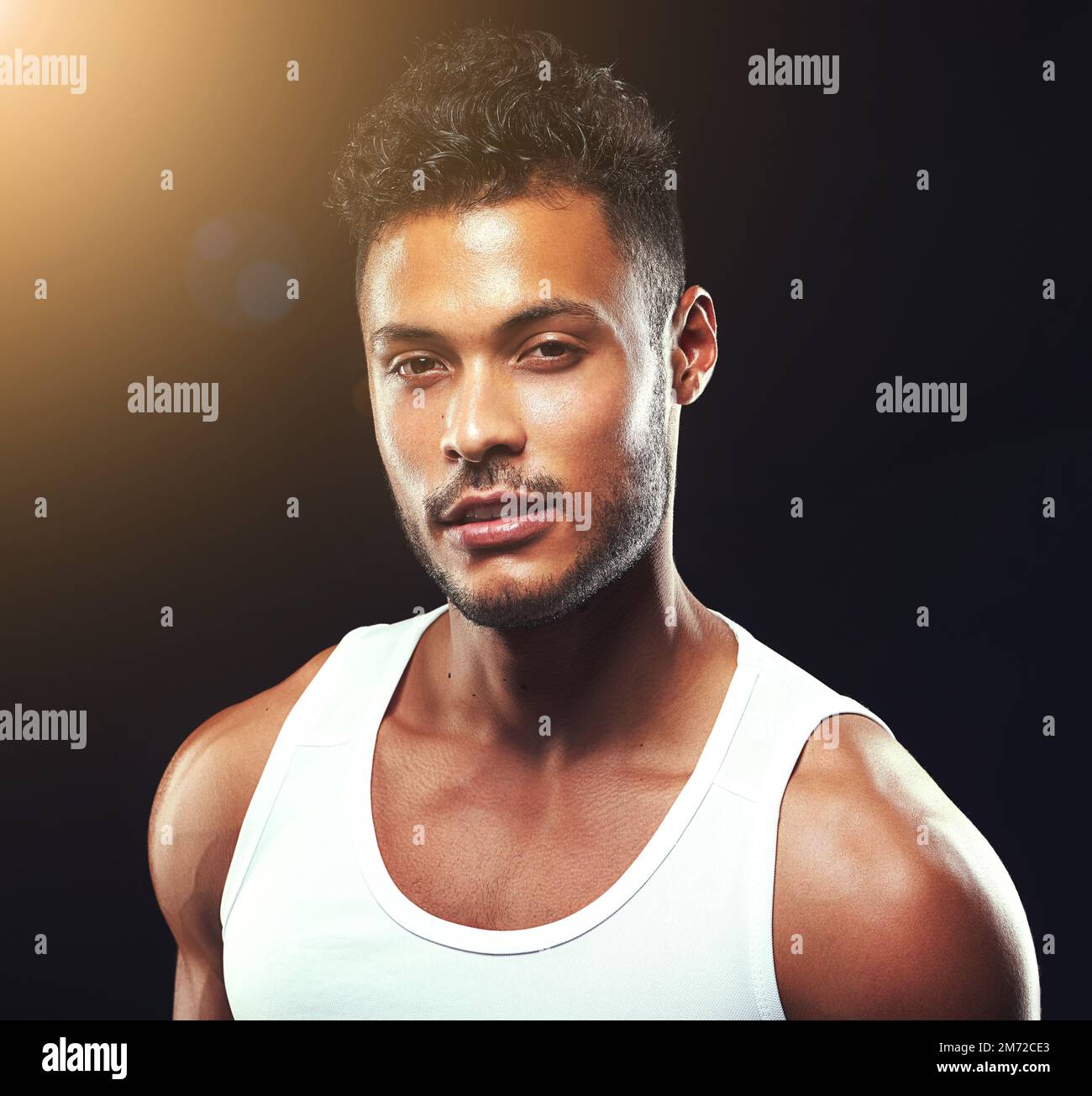 Getting stronger with each workout. Studio shot of a fit young man ...