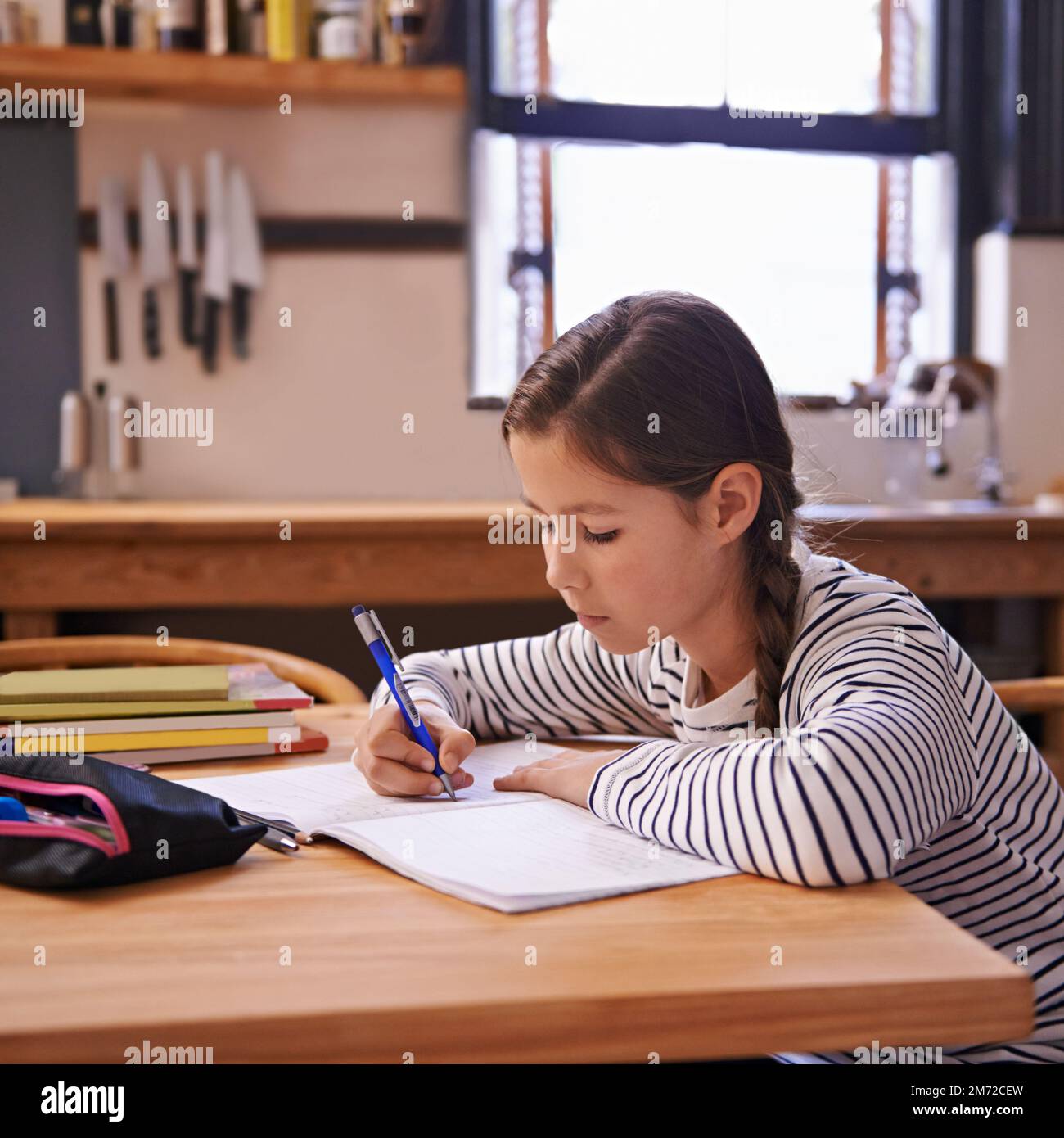 Top of her class... and this is why. A busy young girl doing her ...