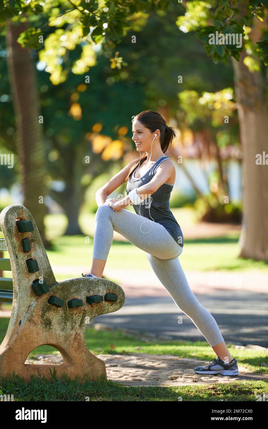 Shes just bench warming. Full length shot of a woman stretching in the ...