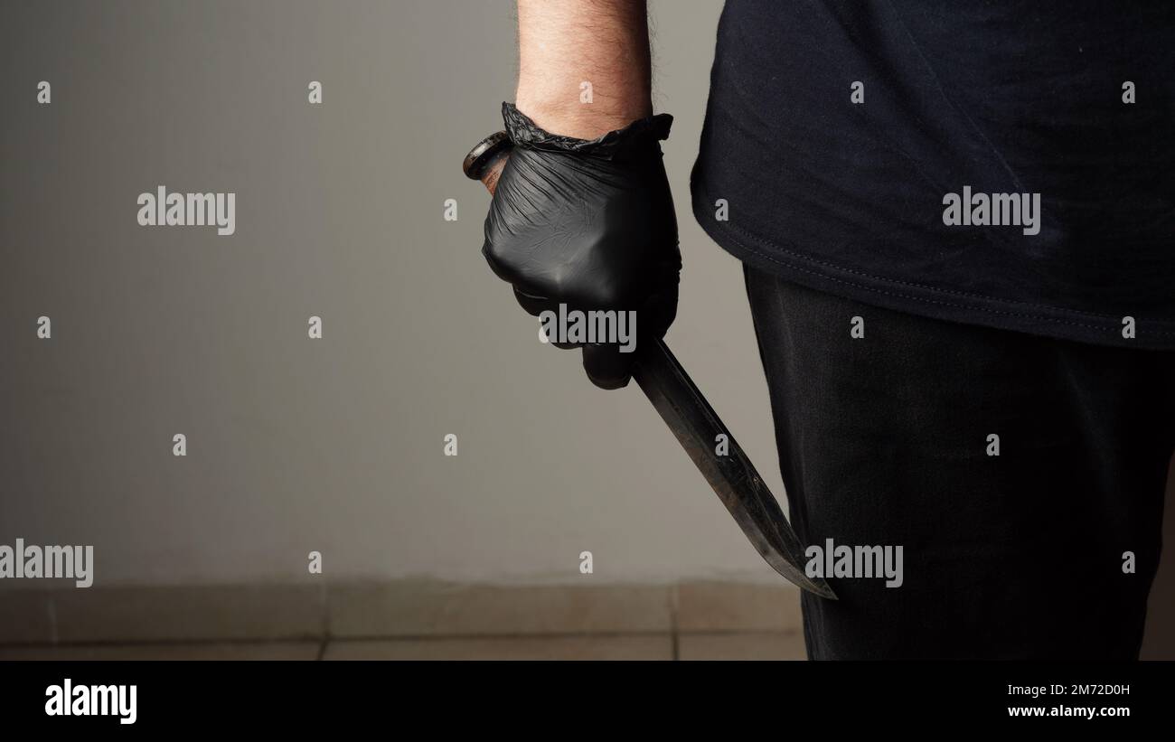 The man with a Combat tactical stainless steel fighting knife in a hand ...