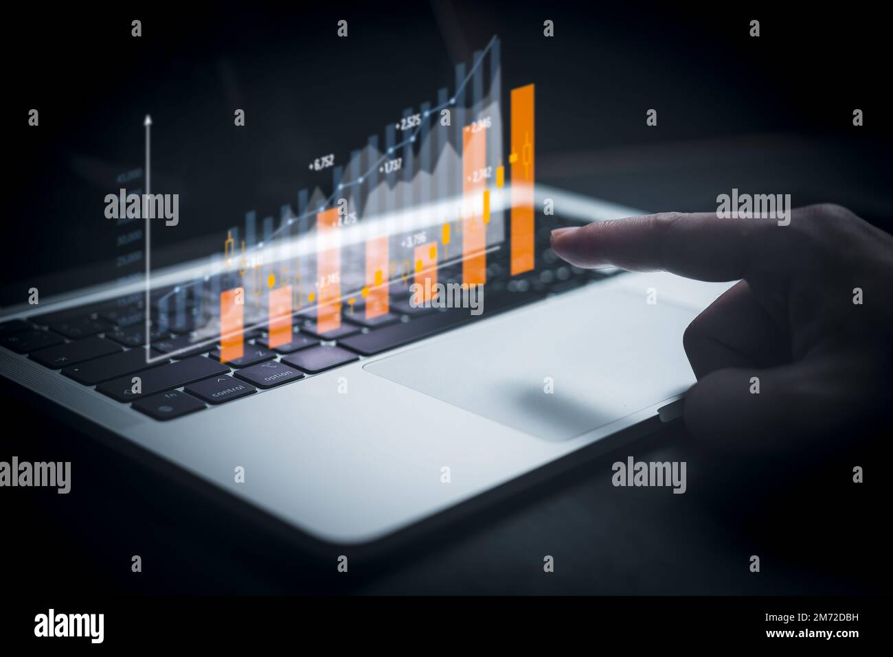 Businessperson using laptop computer with chart. business investment ...