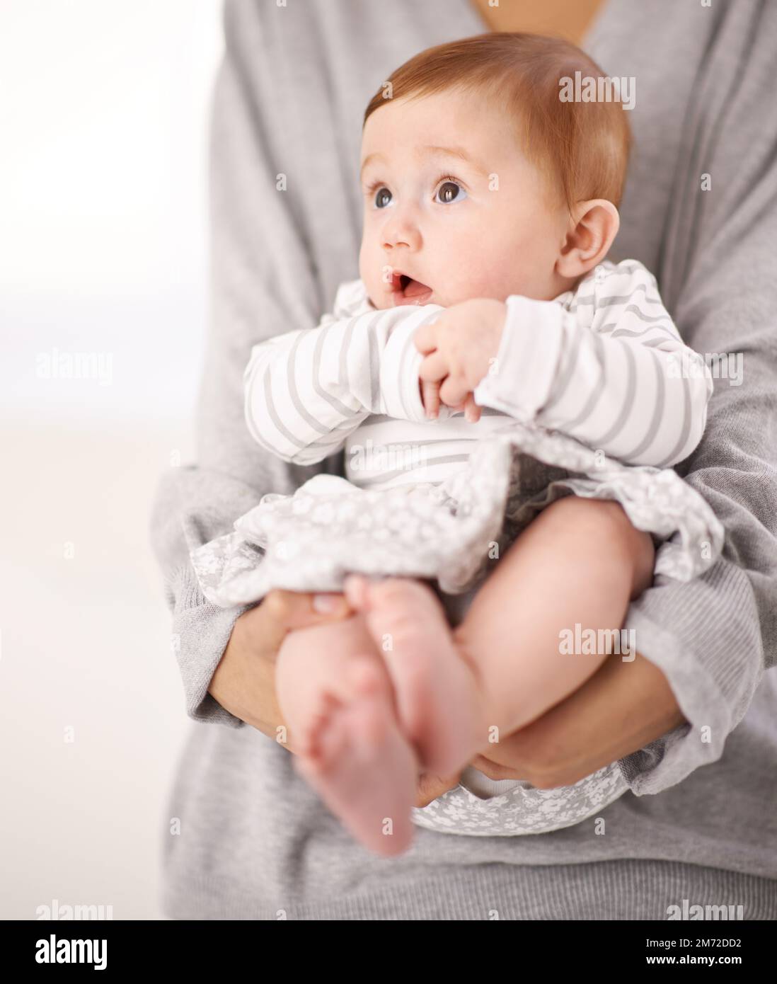 OMG... are you talking to me. Portrait of a baby in her mothers arms ...
