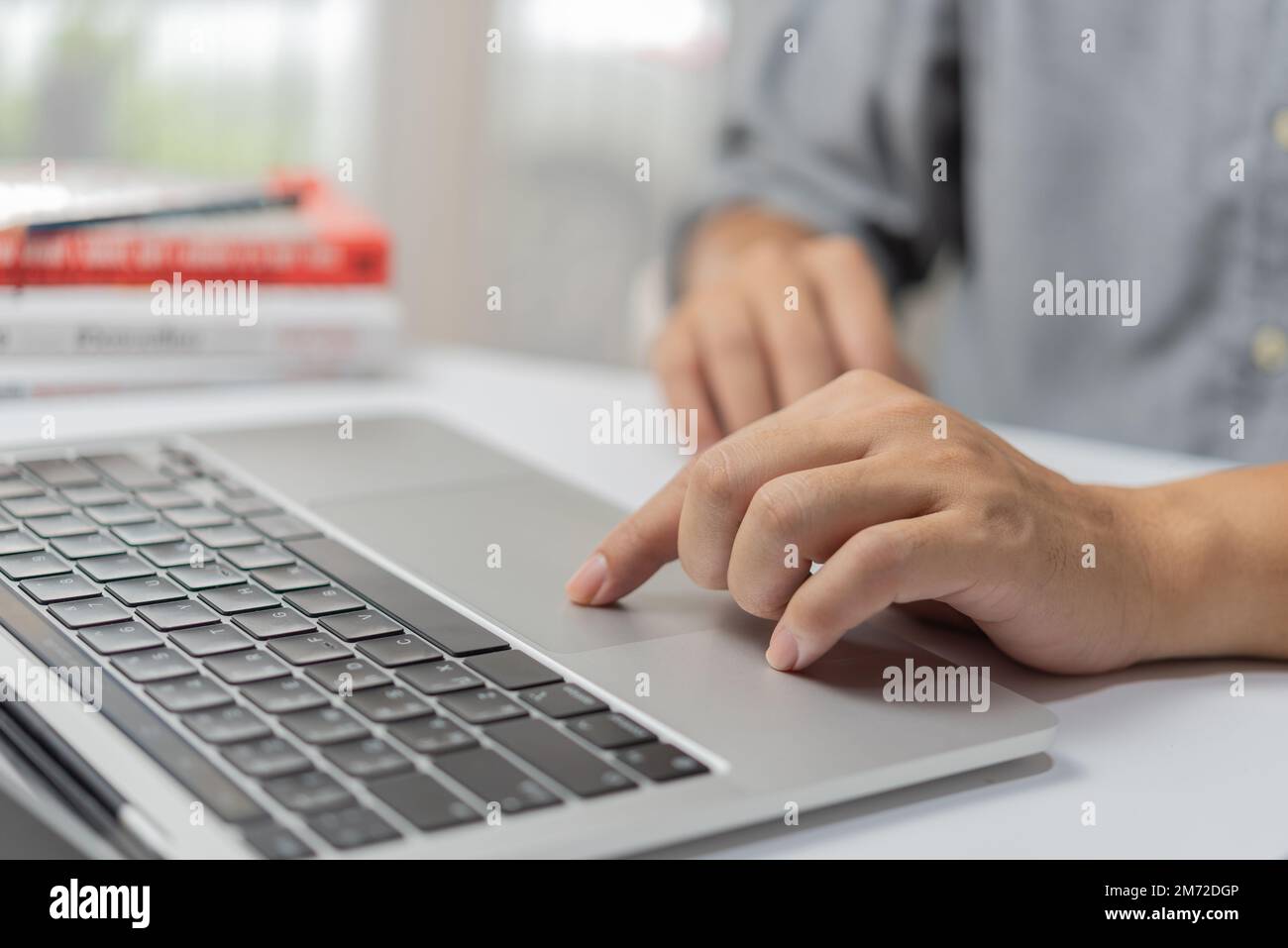 Businessperson using laptop on desk at office. Internet technology ...