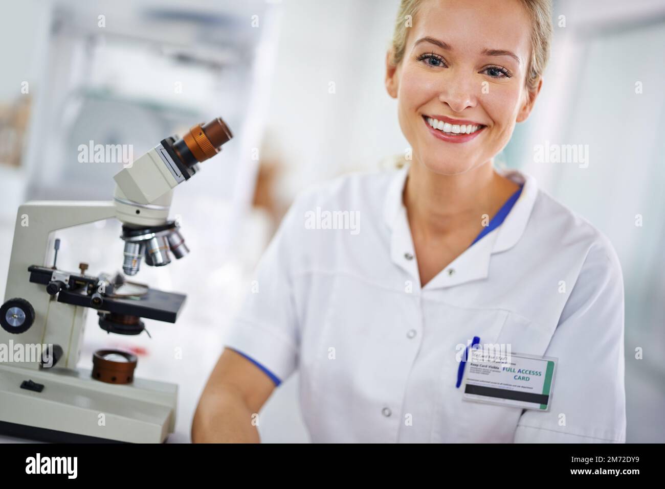 The answers are all in the details. Portrait of a smiling female ...