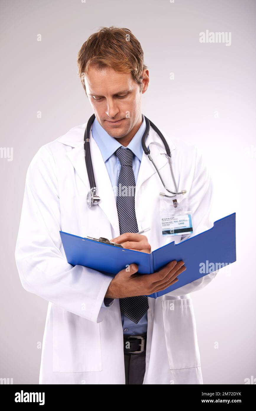 Determining a diagnosis. Cropped studio shot of a handsome doctor ...
