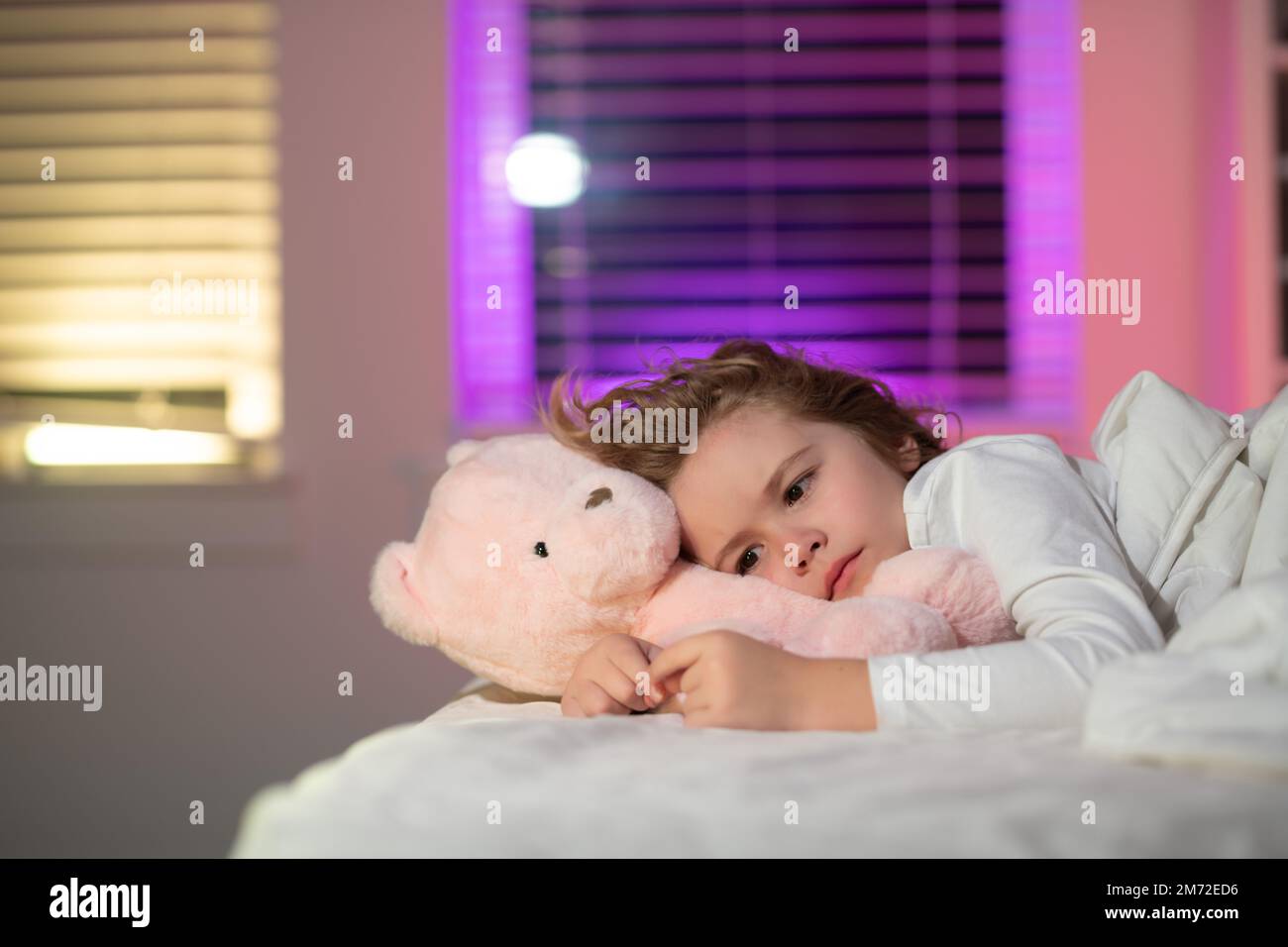 Child cannot sleep on bed at night in bedroom. Kid having sleeplessness ...