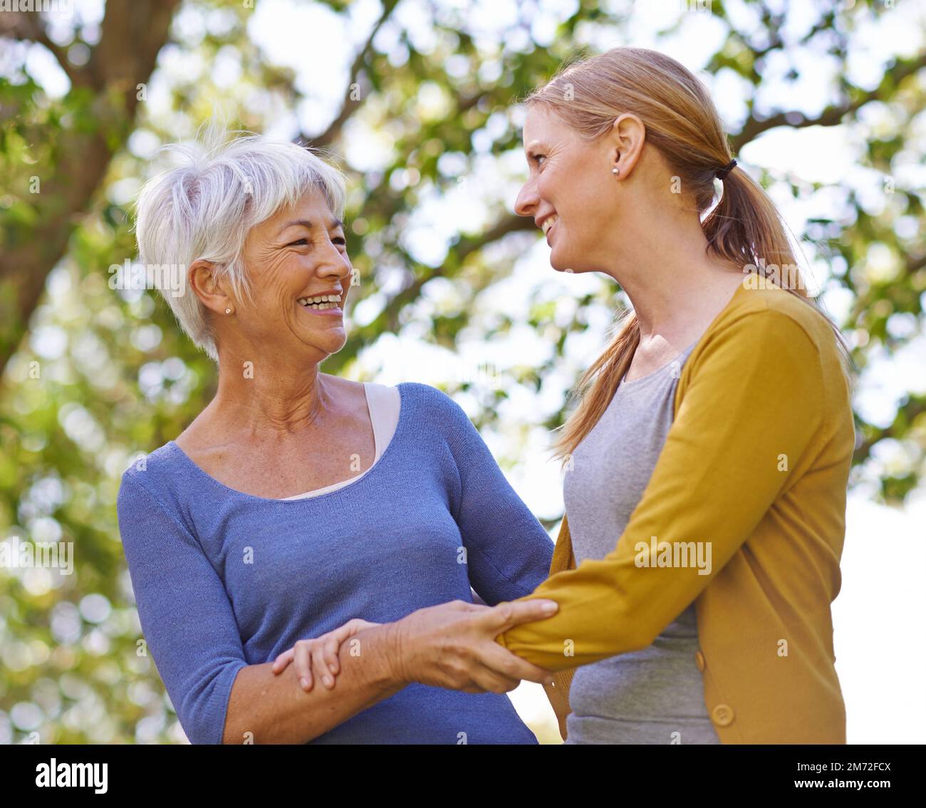 Moms are always there for you. a young woman standing with her mother ...