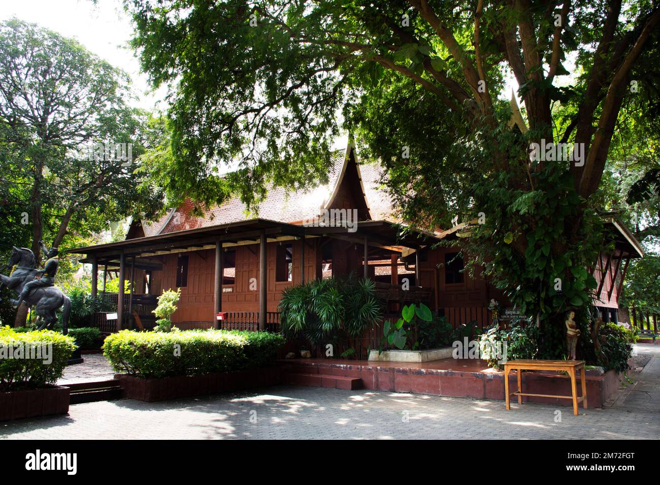 Ancient wooden house or antique wood home in Khum Khun Phaen garden park in Wat Khae temple for ...