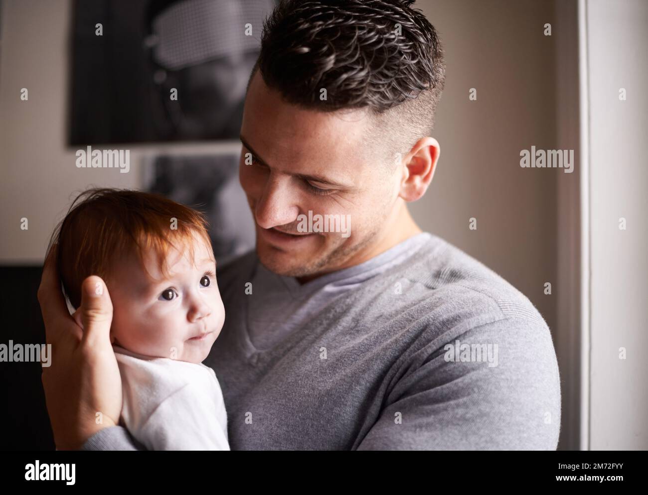 Shell always be safe in my arms. a young father holding his adorable ...