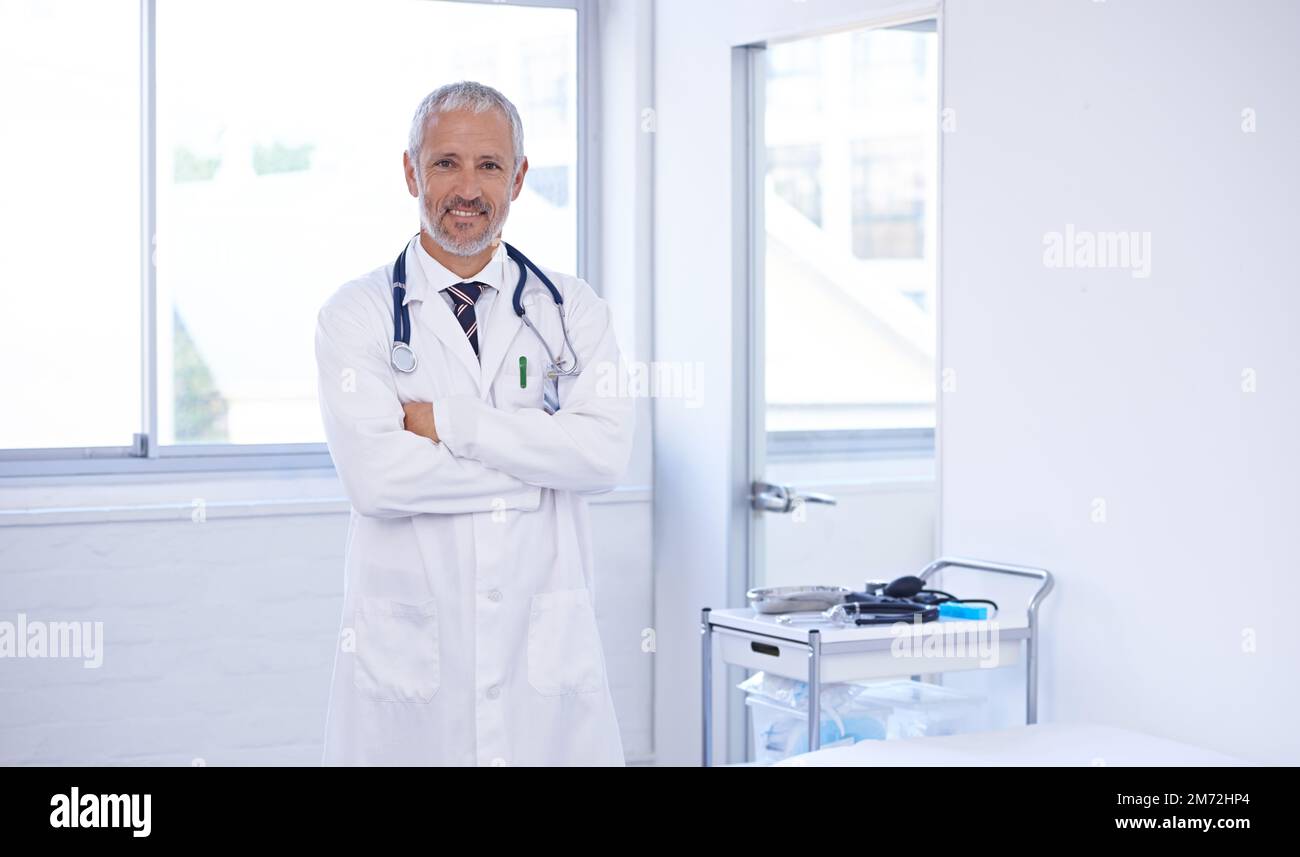 Ready for any emergency. Portrait of a doctor standing in a well-lit ...