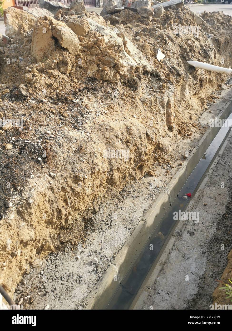 pile of broken concrete slab by the roadside Stock Photo - Alamy