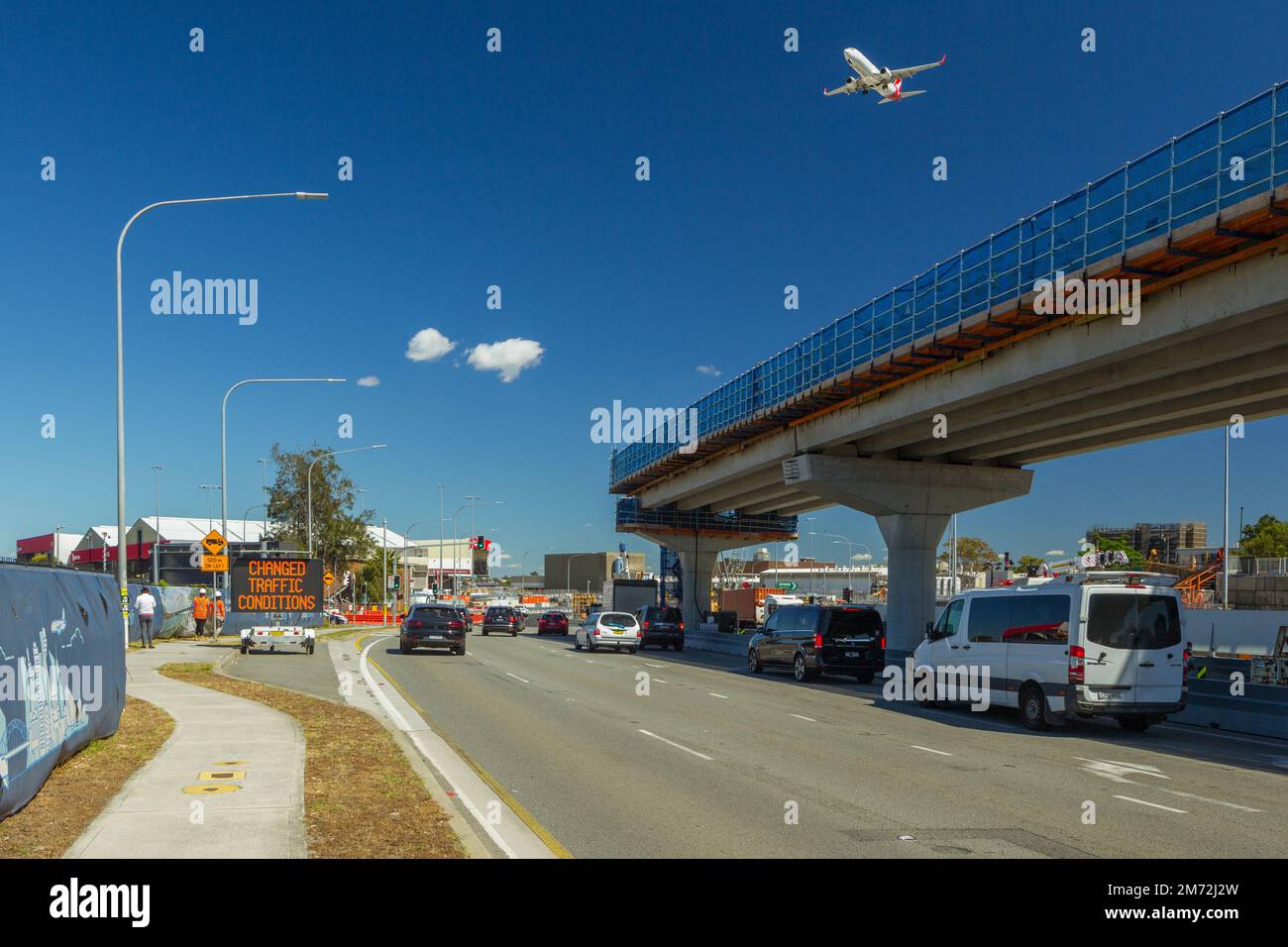 An aircraft landing above the 'Sydney Gateway' road expansion and ...