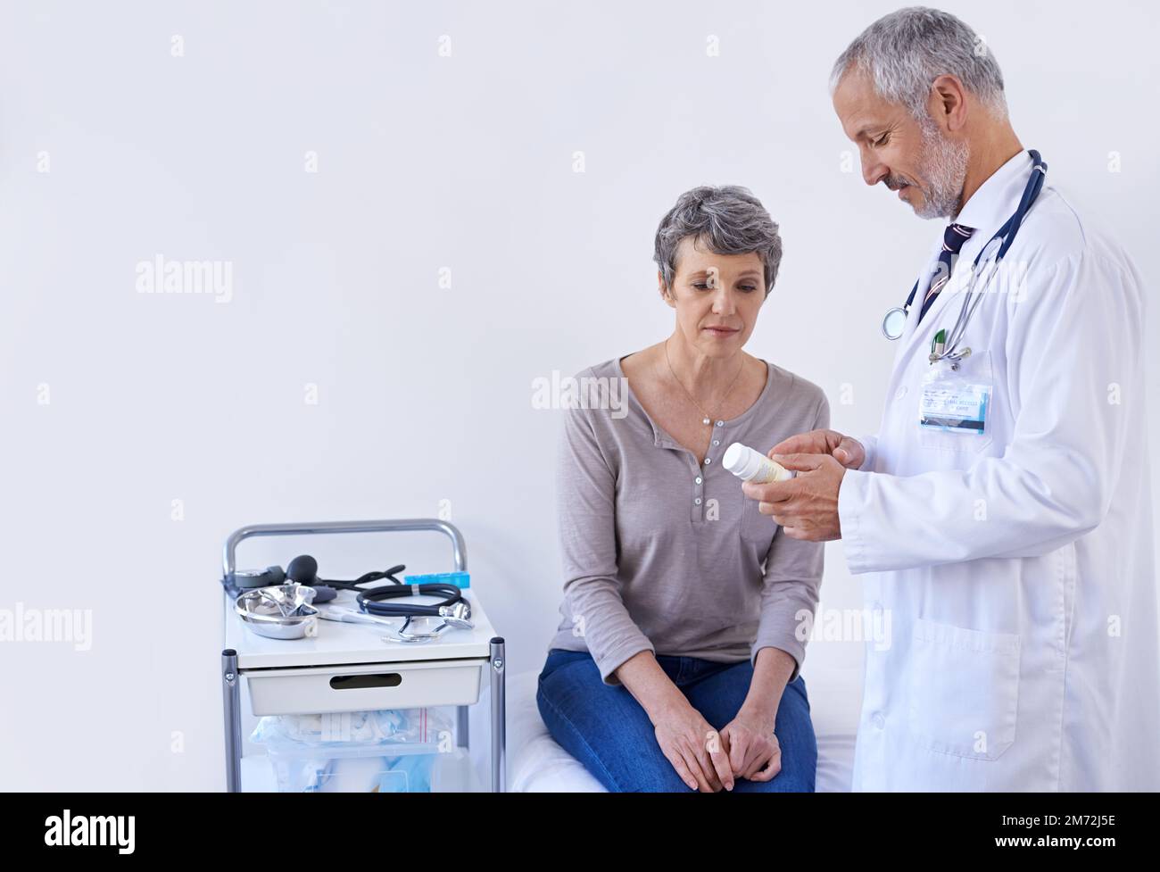 The benefits of good medication. a mature doctor explaining medication ...