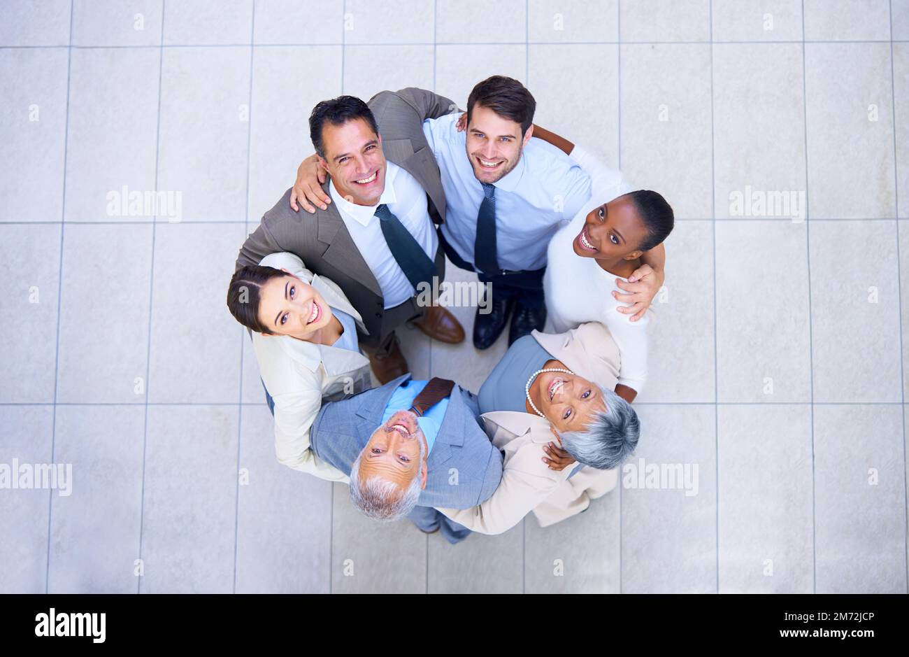 Teamwork makes the dream work. High angle shot of a business team ...