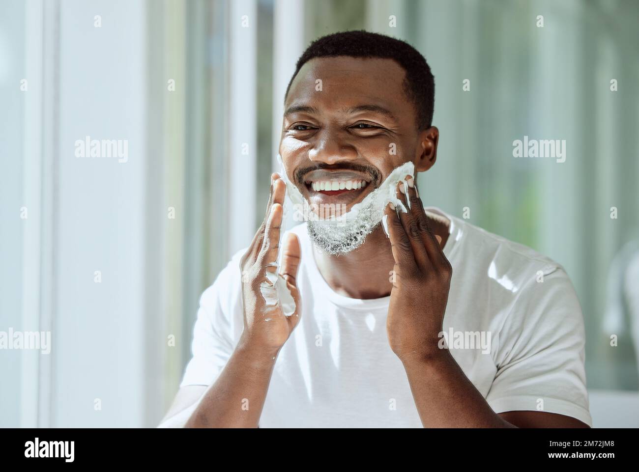 Shaving, cream and black man grooming face for clean look, hygiene care and beauty morning ...