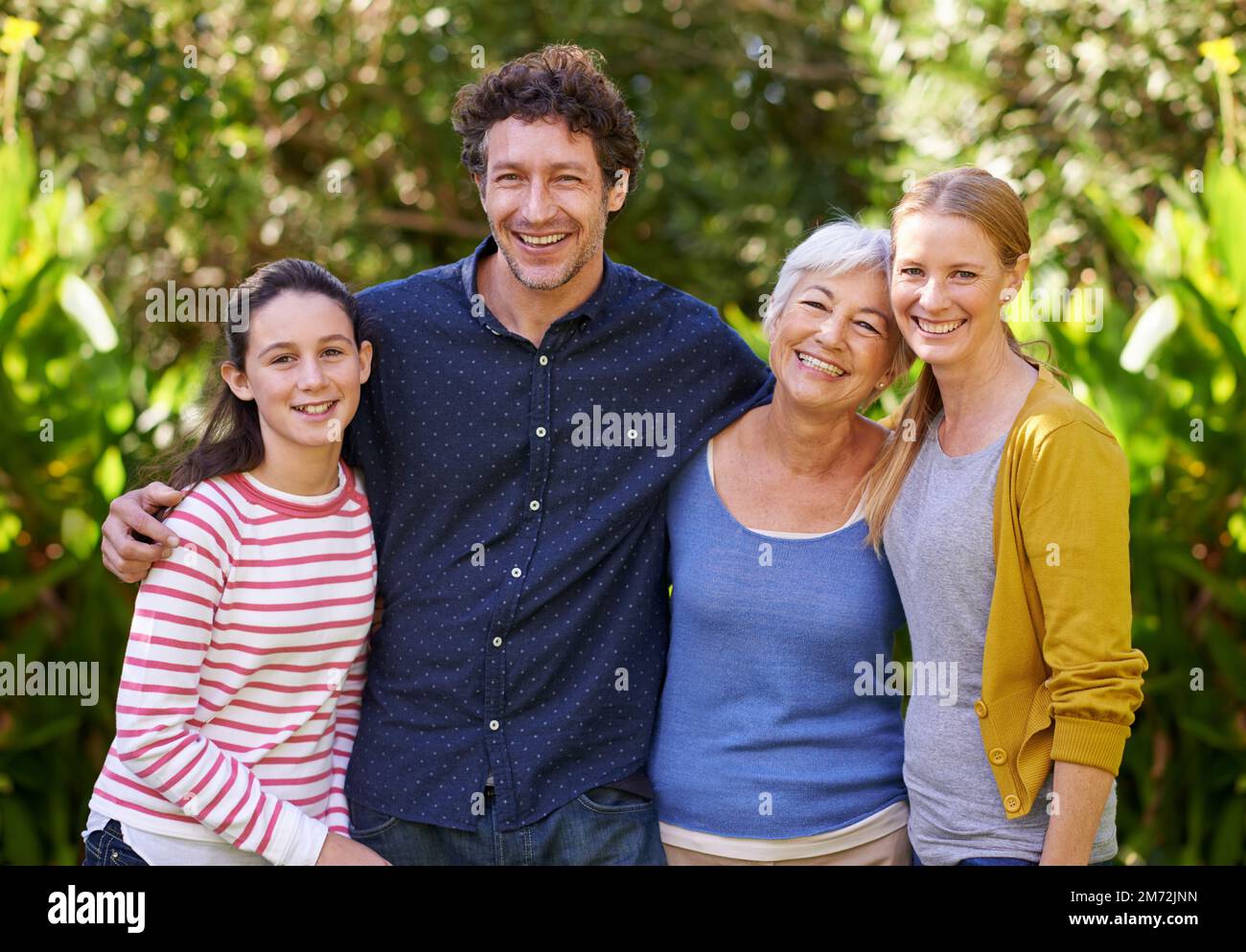 One happy little family. Portrait of a family standing together in the ...