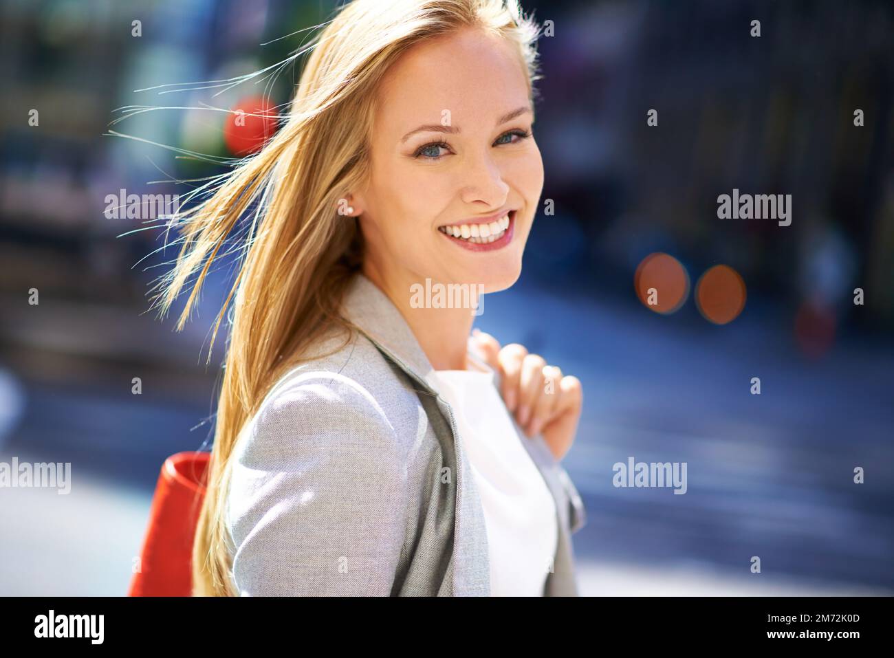 Big city browsing. A portrait of a beautiful young woman in the city ...