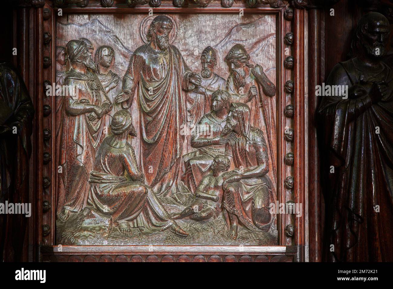 Wooden carving, of Jesus preaching, on the pulpit in the medieval ...