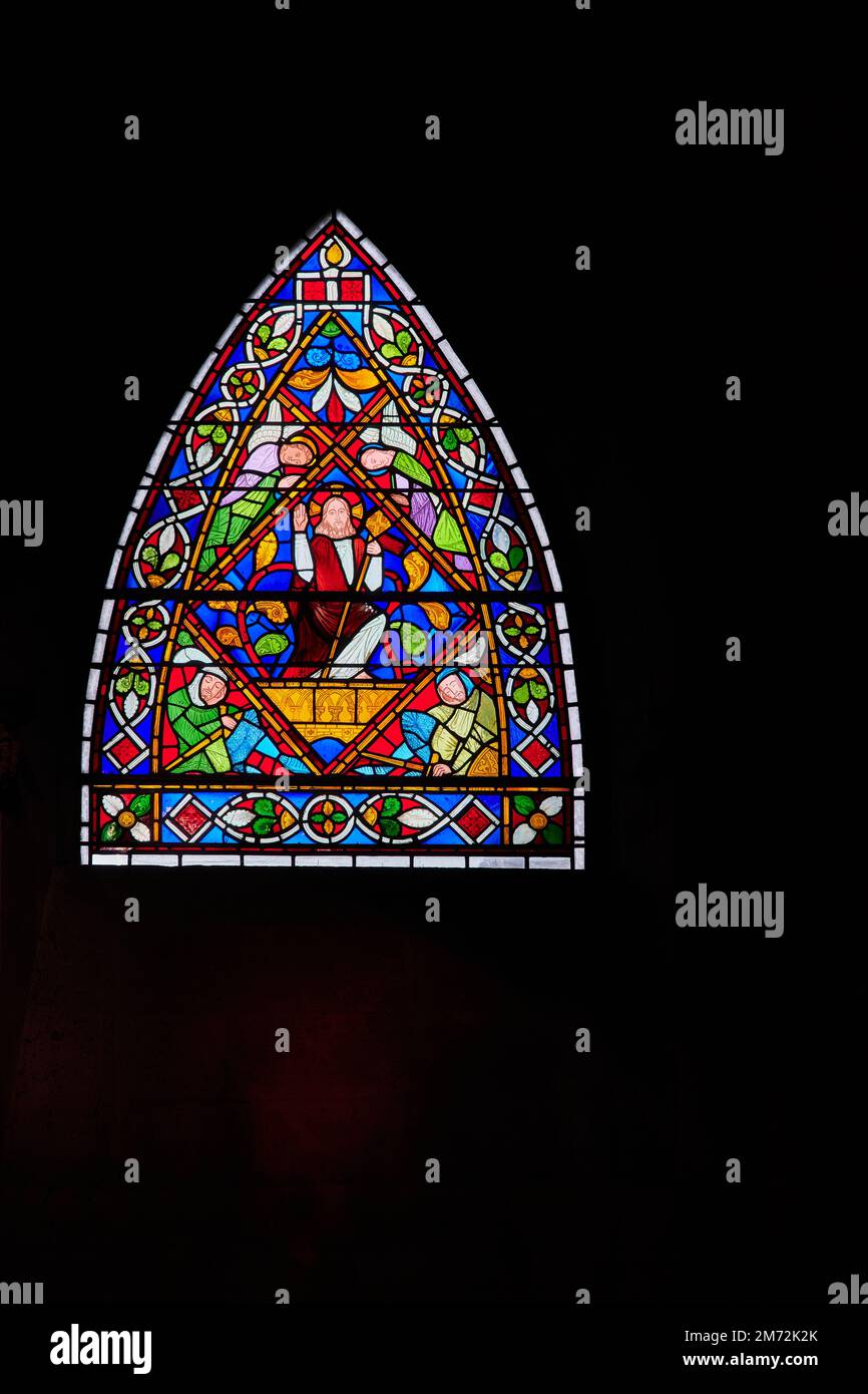 Stained glass window, of the risen Jesus, in the medieval christian ...