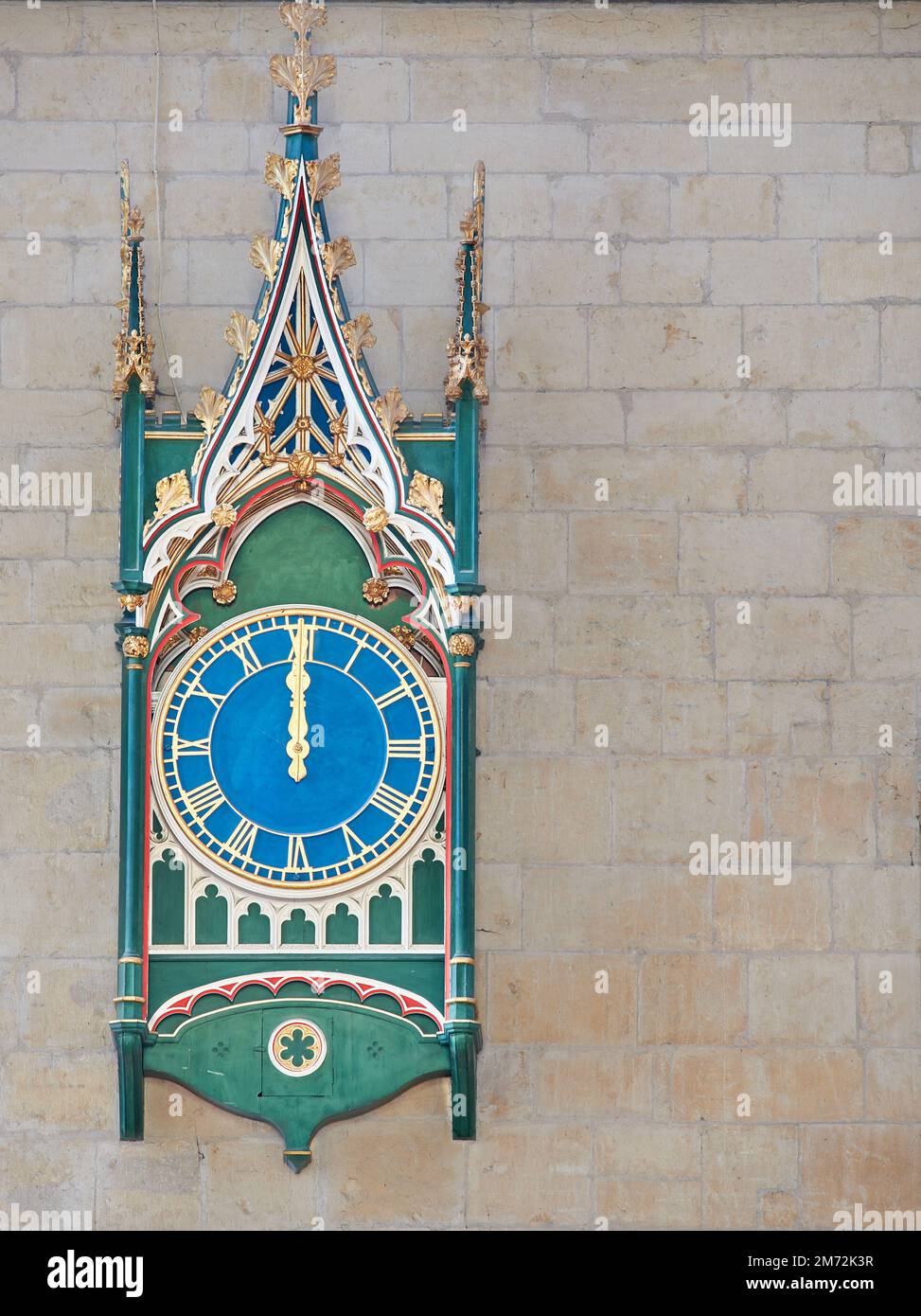 Twelve o'clock midday on the clock in the medieval christian cathedral ...