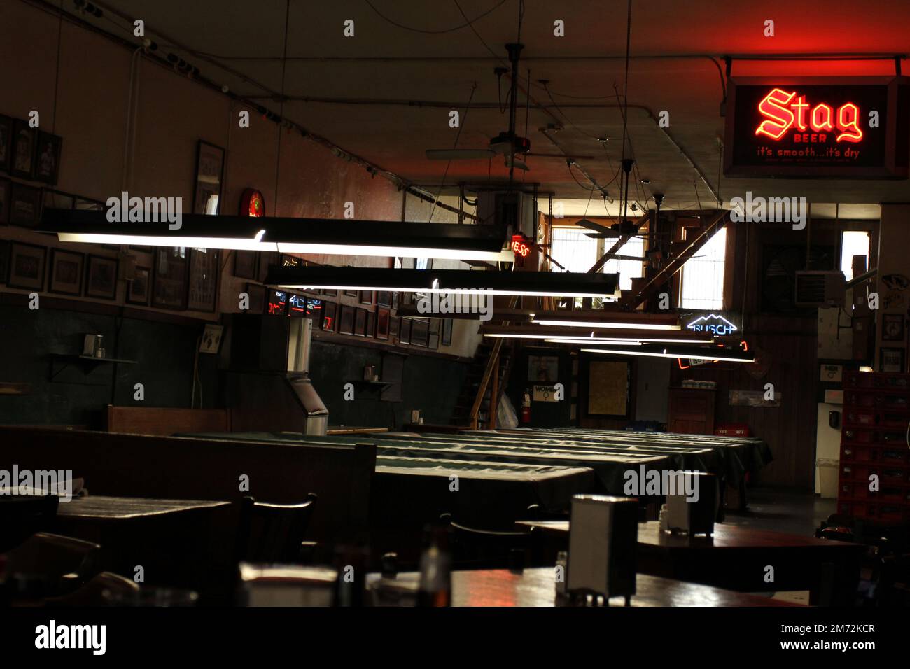 The dimly lit interior of the Booches bar and restaurant with a pool ...