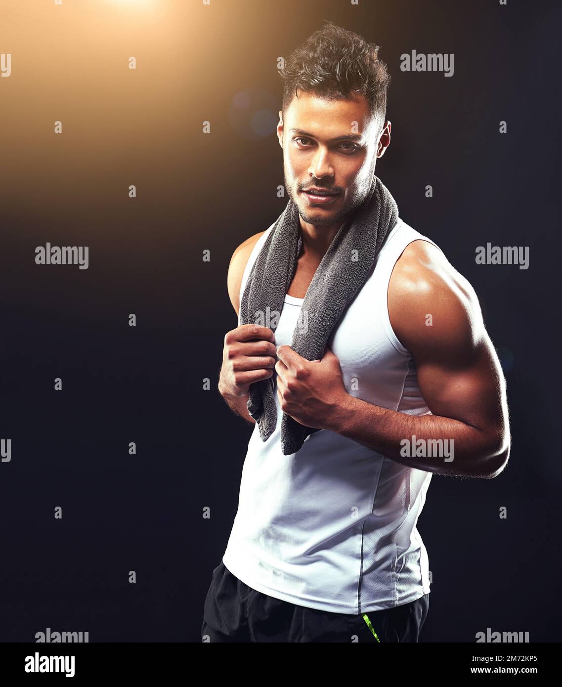 Sweat your way to a killer body. Studio shot of a fit young man ...