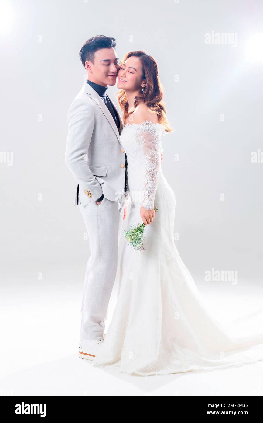 Happy and sweet bride and groom Stock Photo - Alamy
