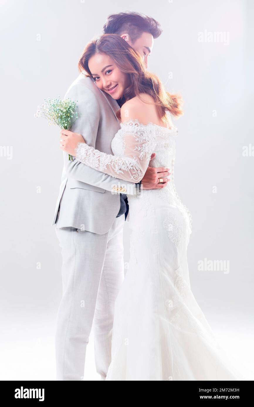 Happy and sweet bride and groom Stock Photo - Alamy