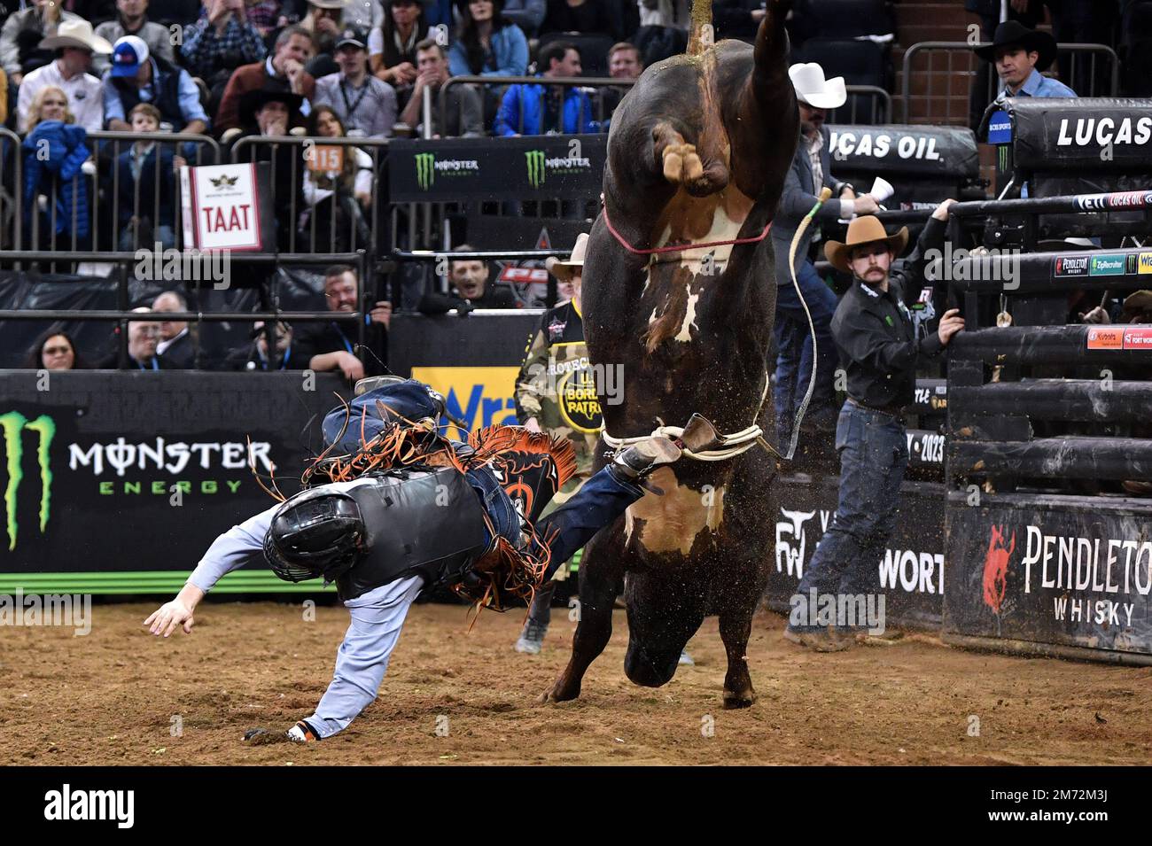 Professional Bull Rider Bob Mitchell (USA) is thrown off a bull named ...