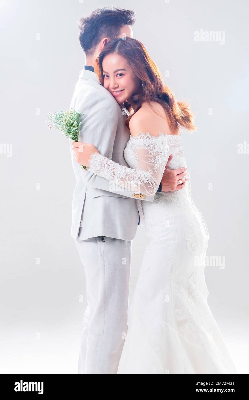 Happy and sweet bride and groom Stock Photo - Alamy