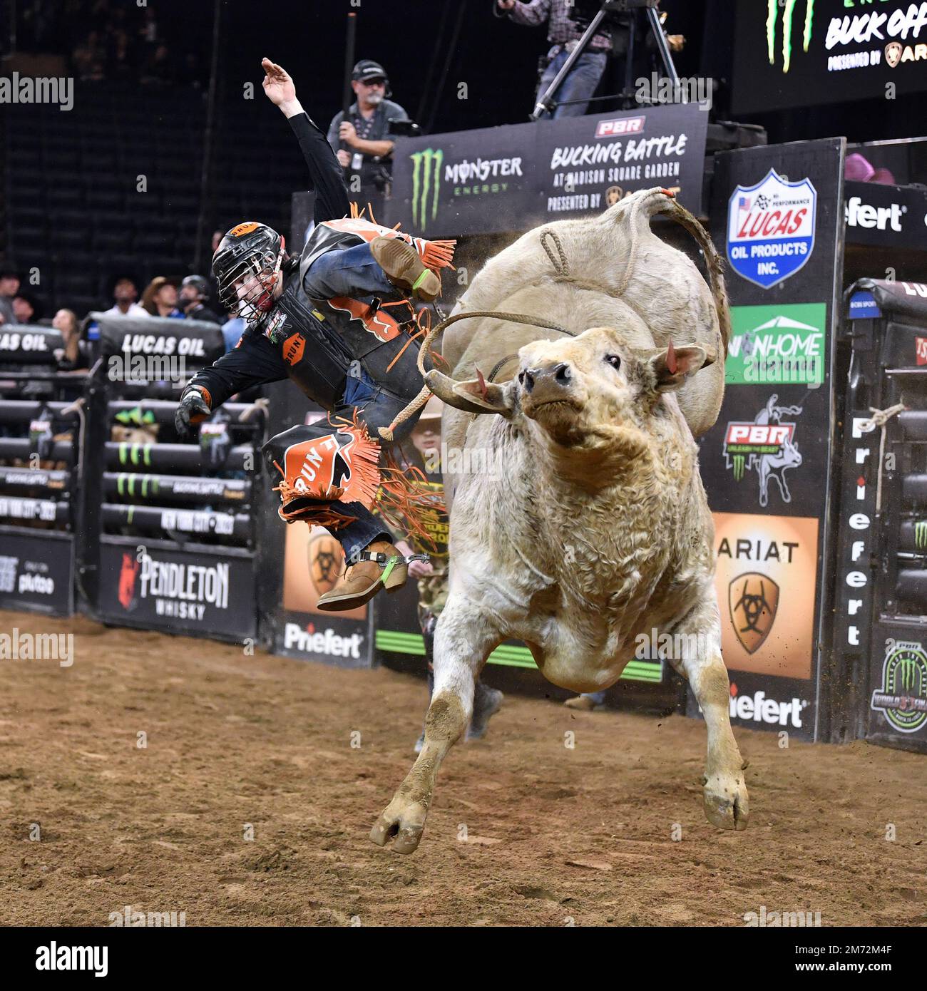 Professional Bull Rider Casey Roberts (USA) is thrown off a bull named Moonlight Party during ...