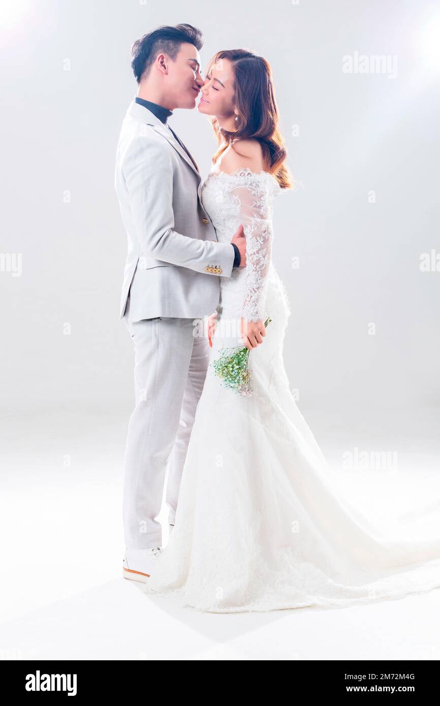 Happy and sweet bride and groom Stock Photo - Alamy