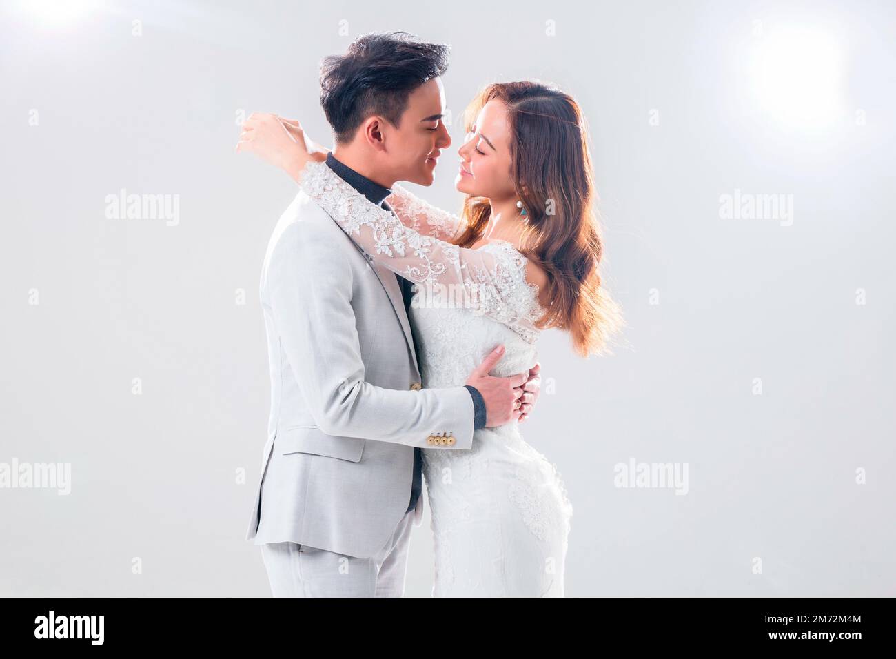 Happy and sweet bride and groom Stock Photo - Alamy